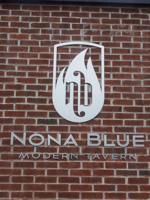 Nona Blue Modern Tavern – Sign out front | Golf, by TourMiss